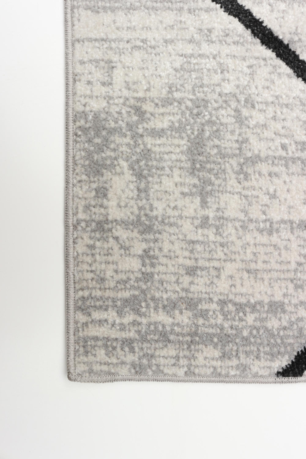 Damali Ivory/Black Machine Washable Area Rug - 2'6" x 8'0" - The Brick