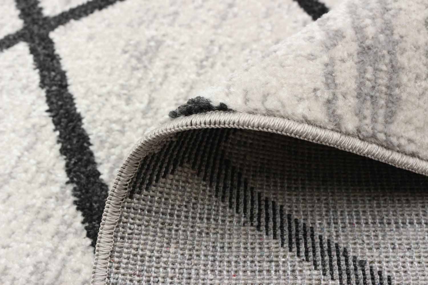 Damali Ivory/Black Machine Washable Area Rug - 2'6" x 8'0" - The Brick